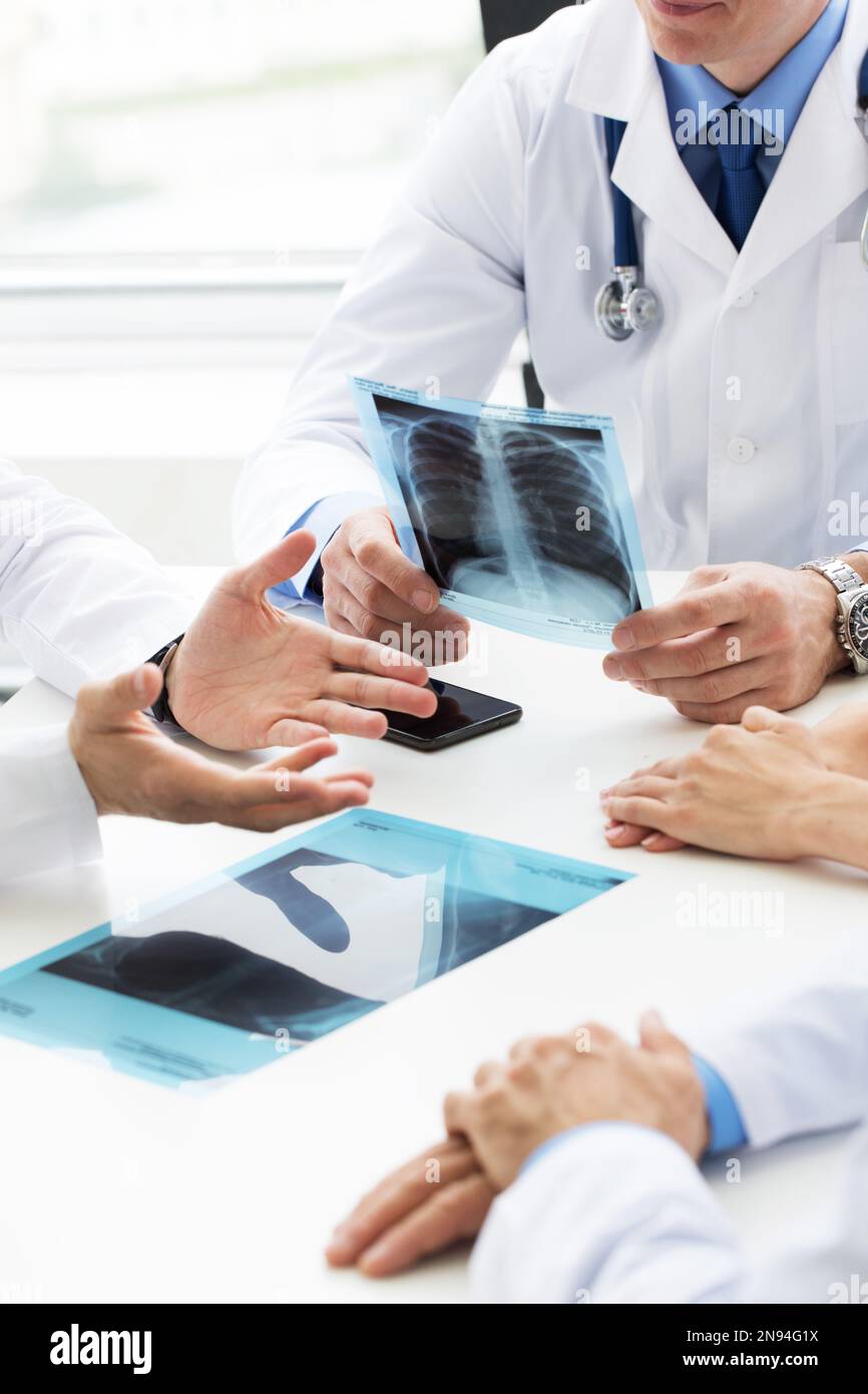 Medical team checking Xray results, medical consultation in the clinic ...