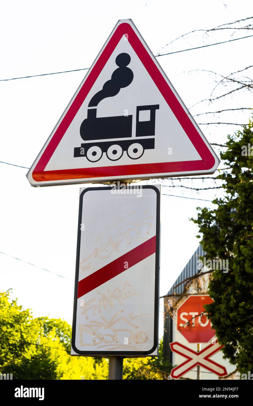 Vertical traffic road sign with a train on sky Stock Photo - Alamy