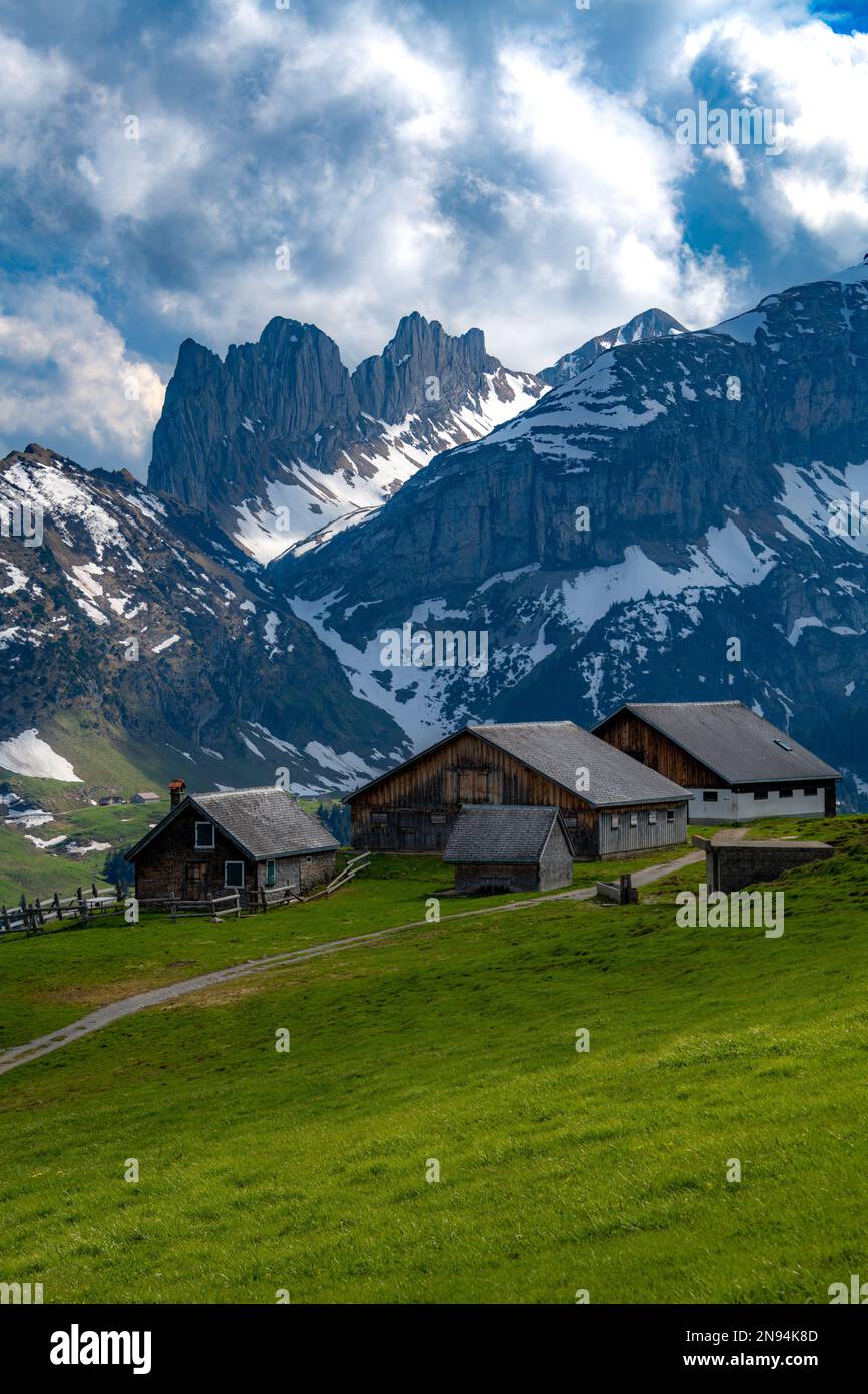 a farm in the mountains, with dramatic skies Stock Photo - Alamy