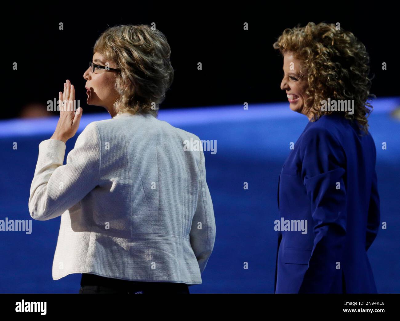 Former Rep. Gabrielle Giffords, left, blows kisses with Democratic ...