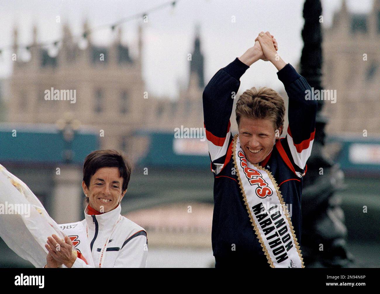 Norway's Ingrid Kristiansen does a boxing style victory salute after ...