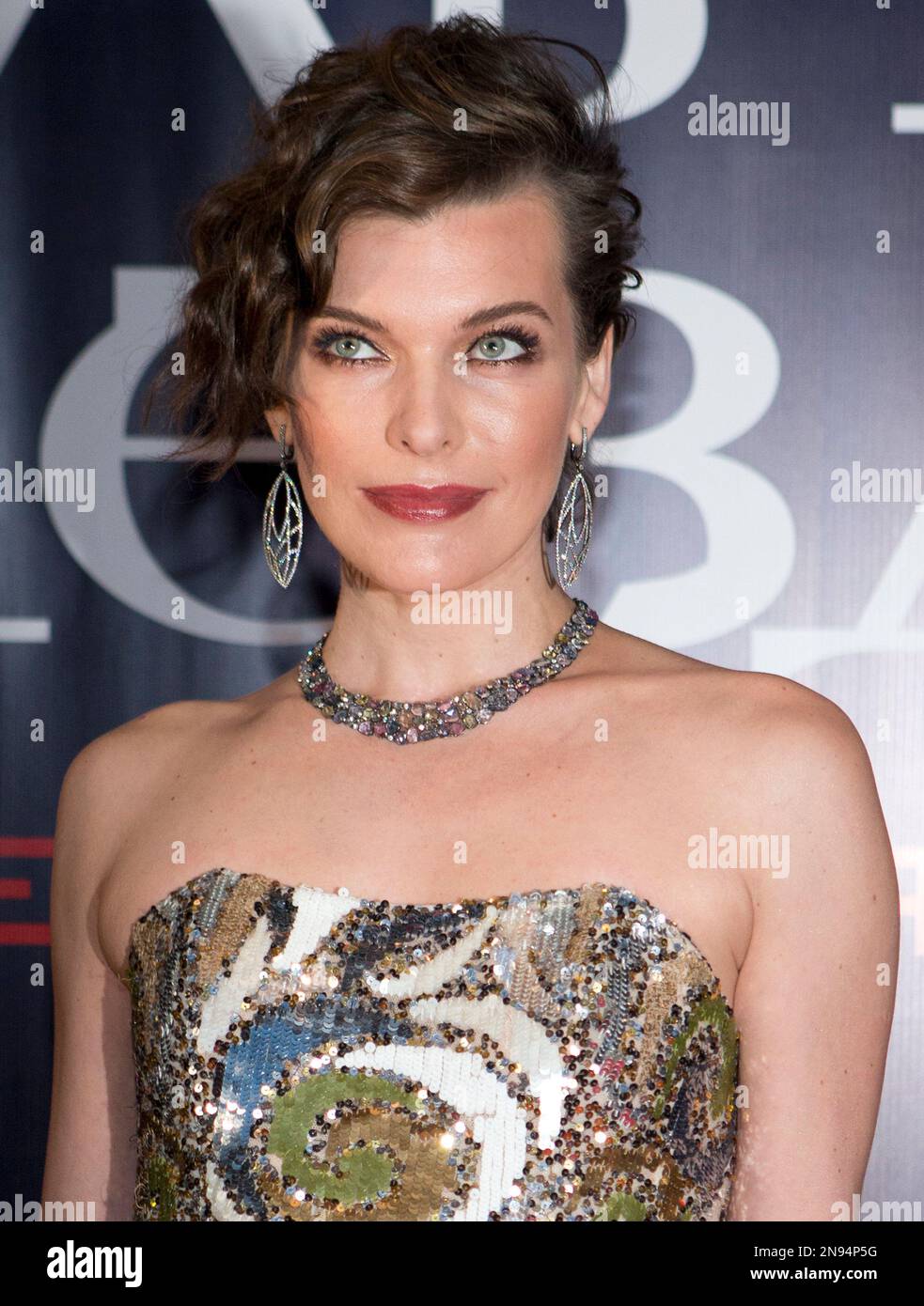 Actress Milla Jovovich poses for photographers during a red carpet ...