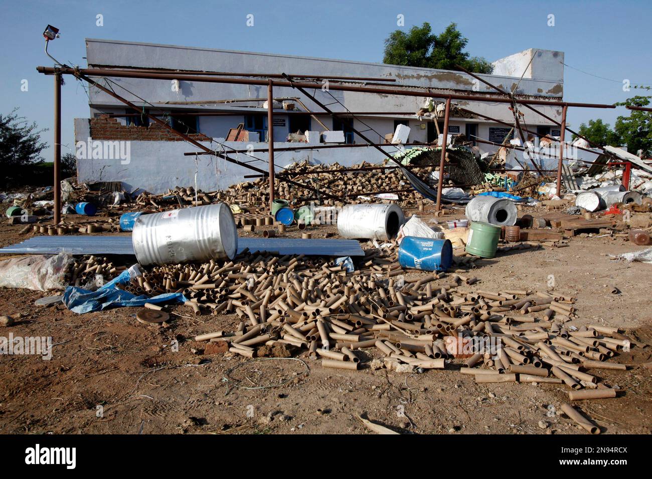 Empty chemical cans and burnt cartridges of fire crackers lie scattered ...