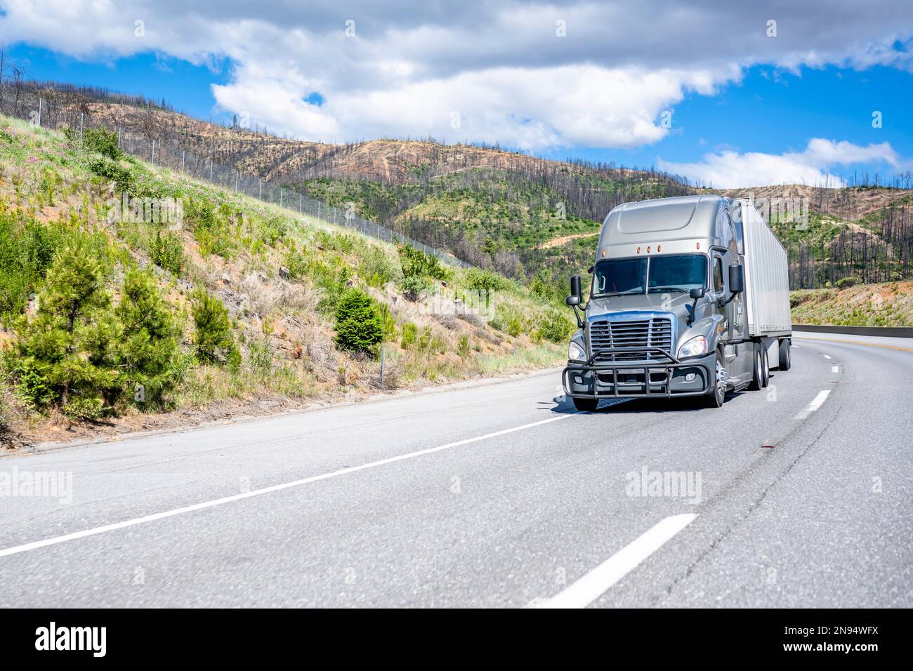 Industrial long hauler big rig gray semi truck tractor with grille ...