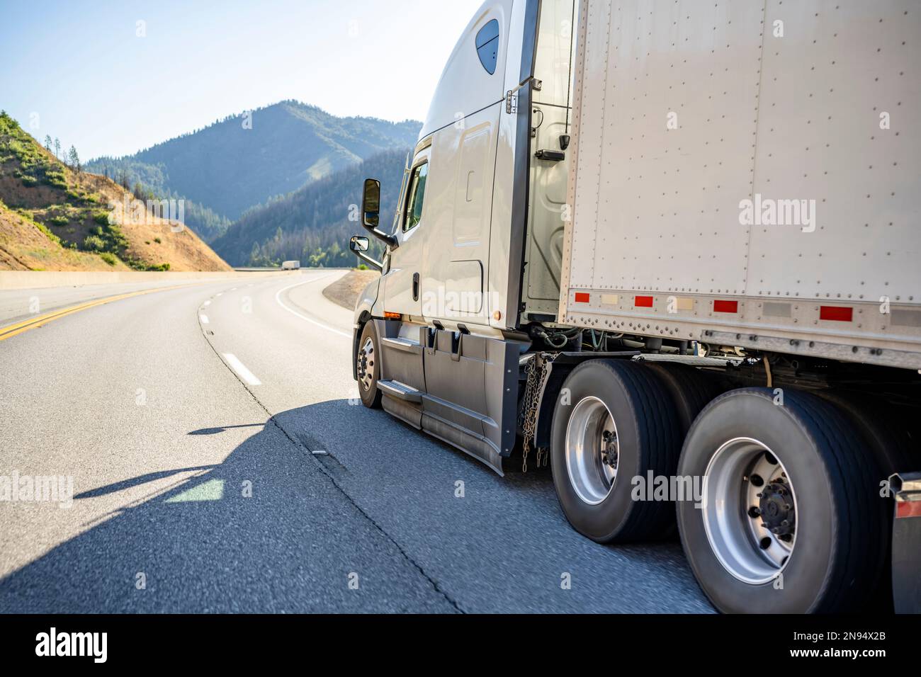 Industrial long hauler big rig white semi truck tractor with ...