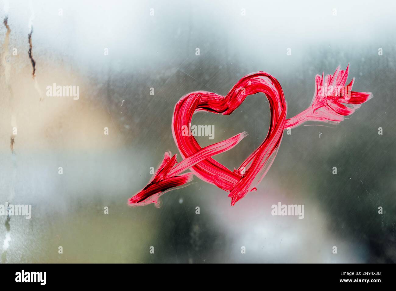 Painted red heart on glass Stock Photo - Alamy
