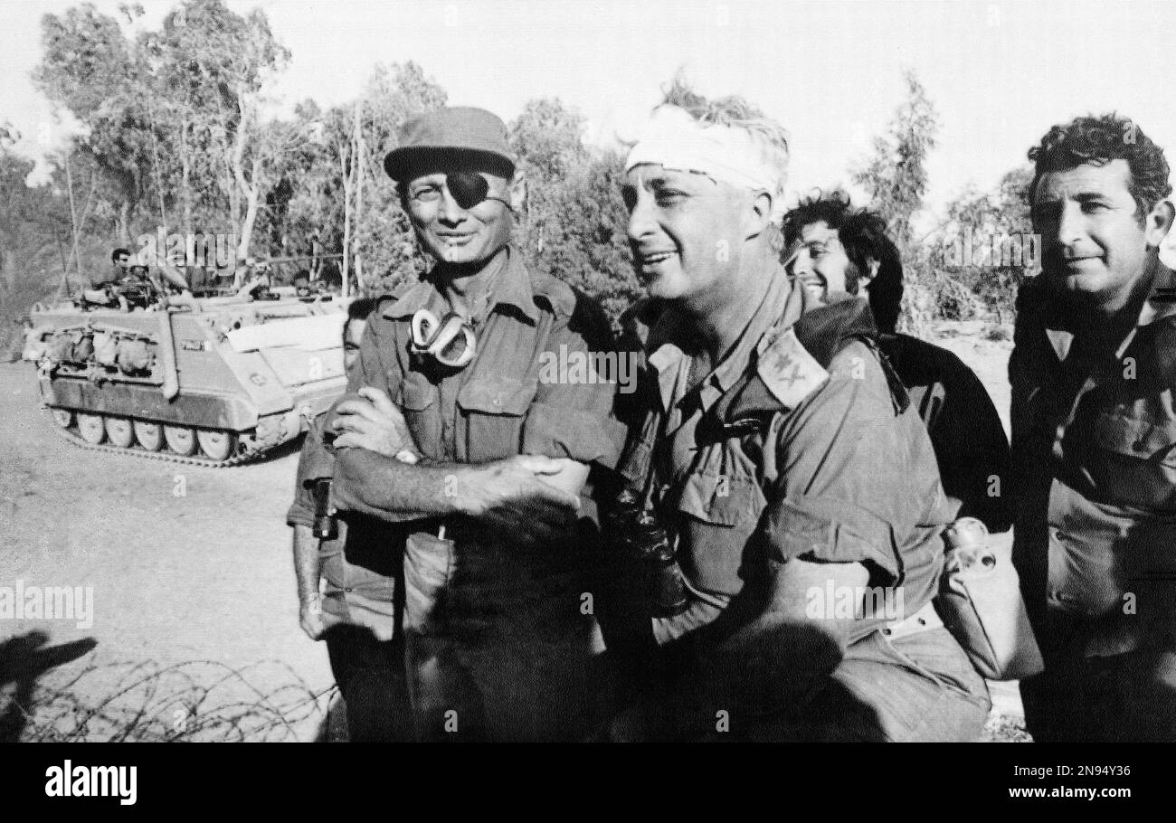 Defense Minister Moshe Dayan, left, and Maj. Gen. Ariel Sharon, second ...