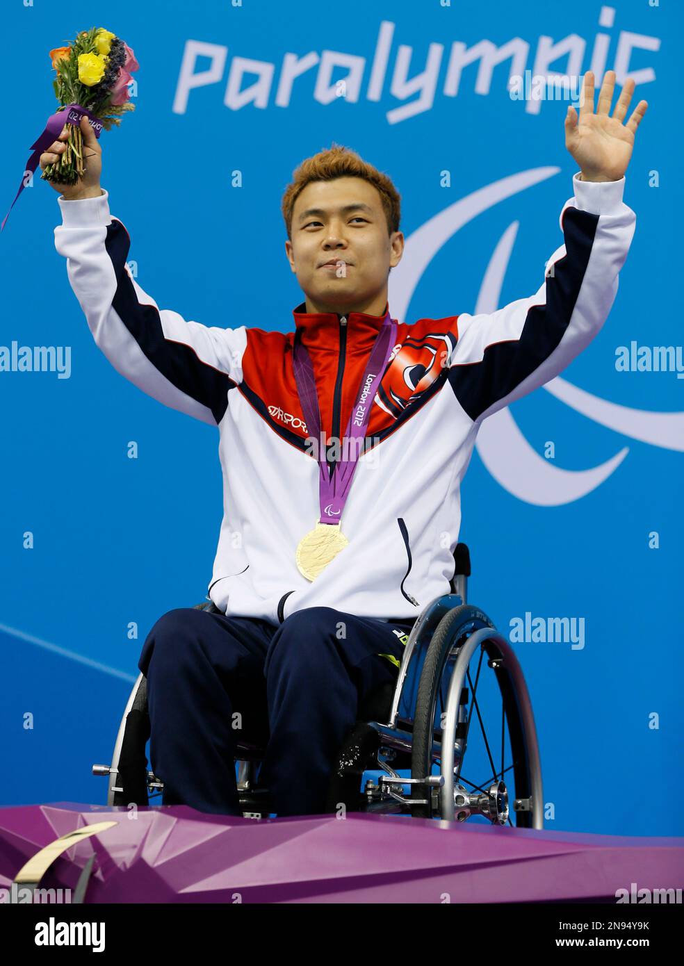 South Korea's Lim Woo-geun celebrates during the medal ceremony after ...