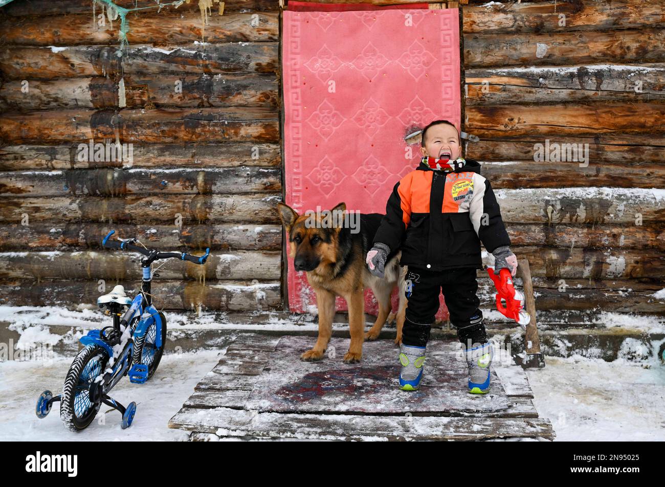 Urumqi. 11th Jan, 2023. A boy plays at Hemu Village in the Altay ...