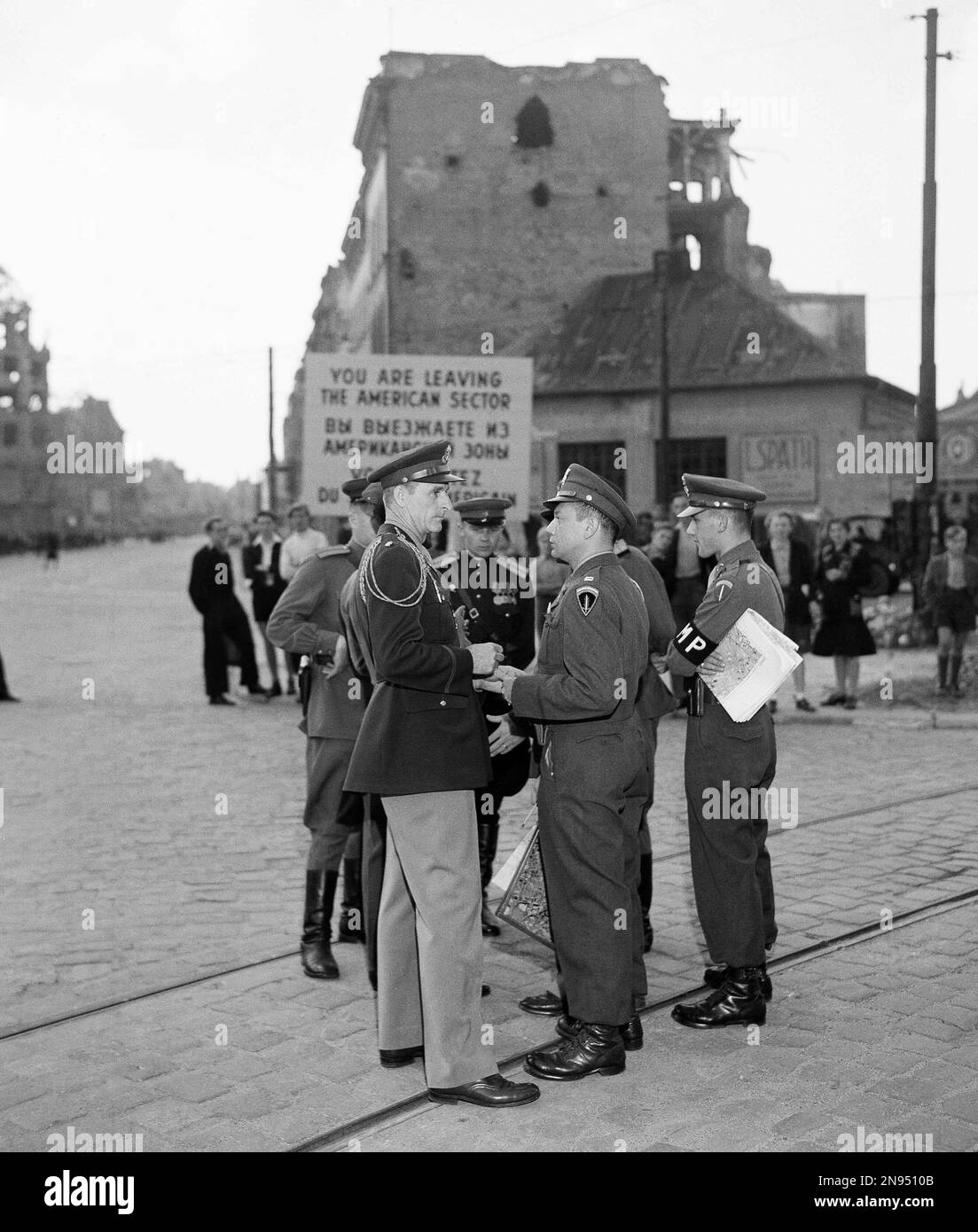 U.S. Army officers hold a street conference with two Russian officers ...