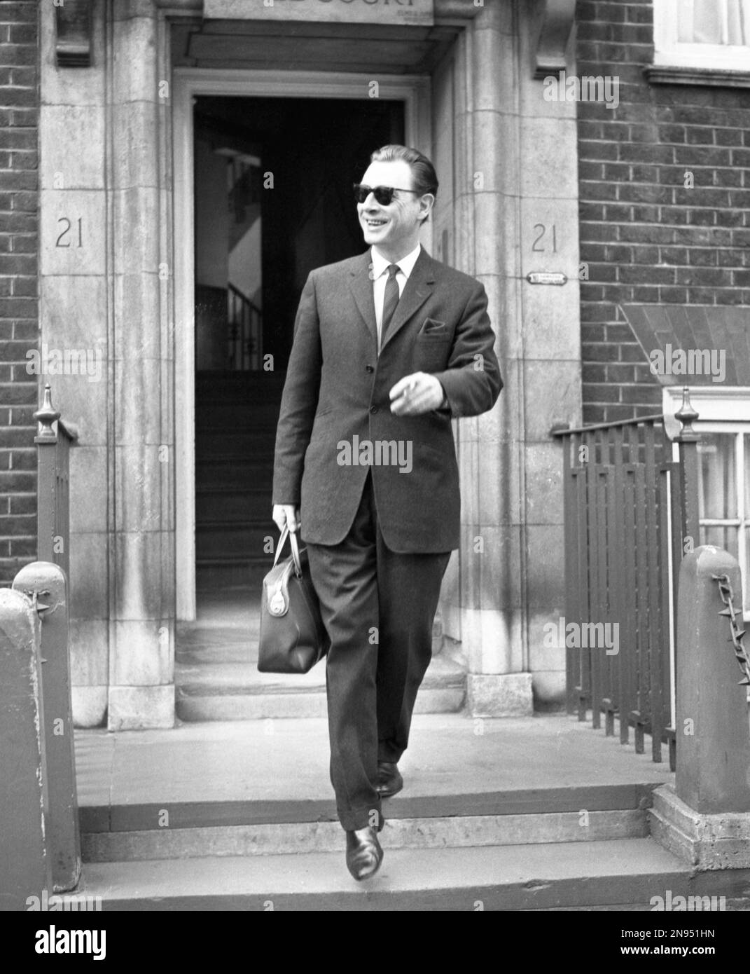 Stephen Ward leaves a residence in Chelsea, London, on July 30, 1963 ...
