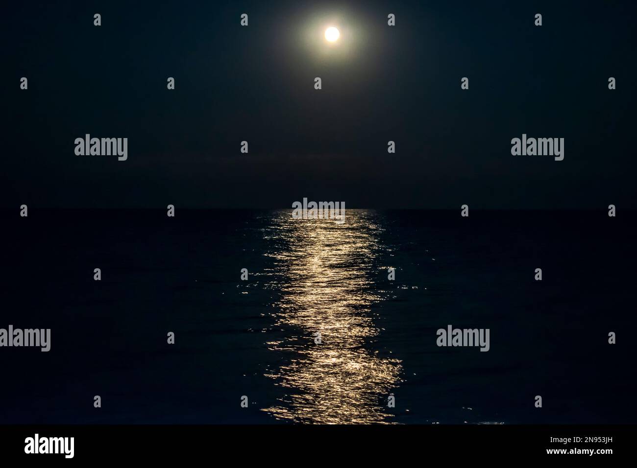The fool moon over the sea and the moonpath Stock Photo - Alamy
