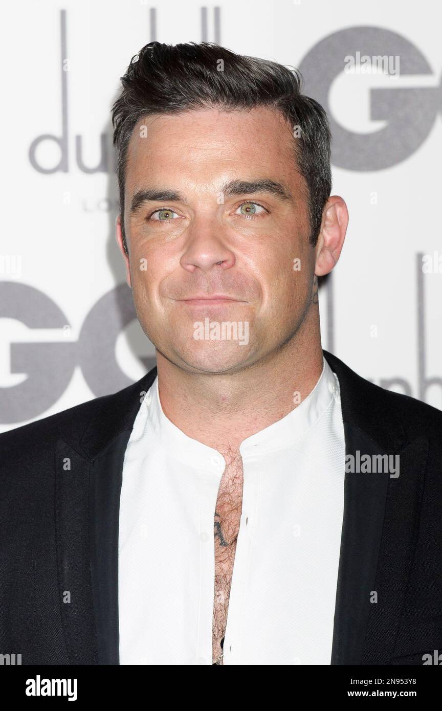 Robbie Williams arrives for the GQ Men of the Year Awards at a central ...
