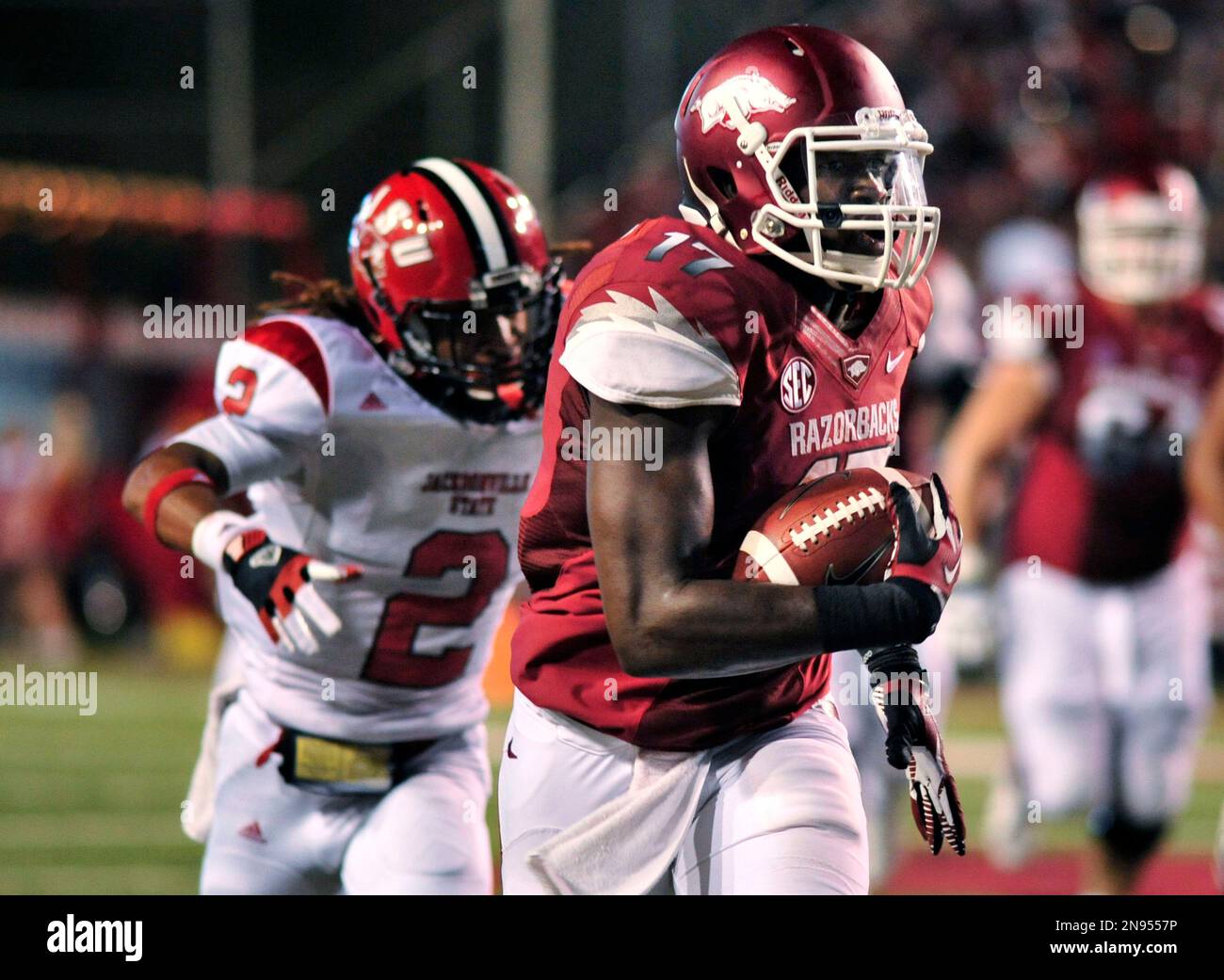 Arkansas quarterback Brandon Mitchell (17) runs away from Jacksonville ...