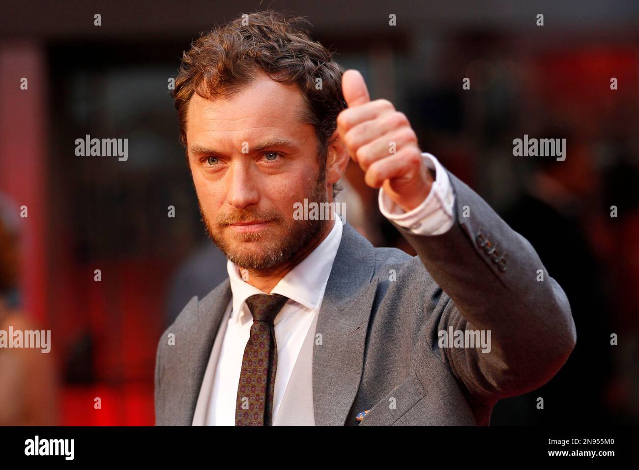 Cast member British actor Jude Law poses as he arrives for the world ...
