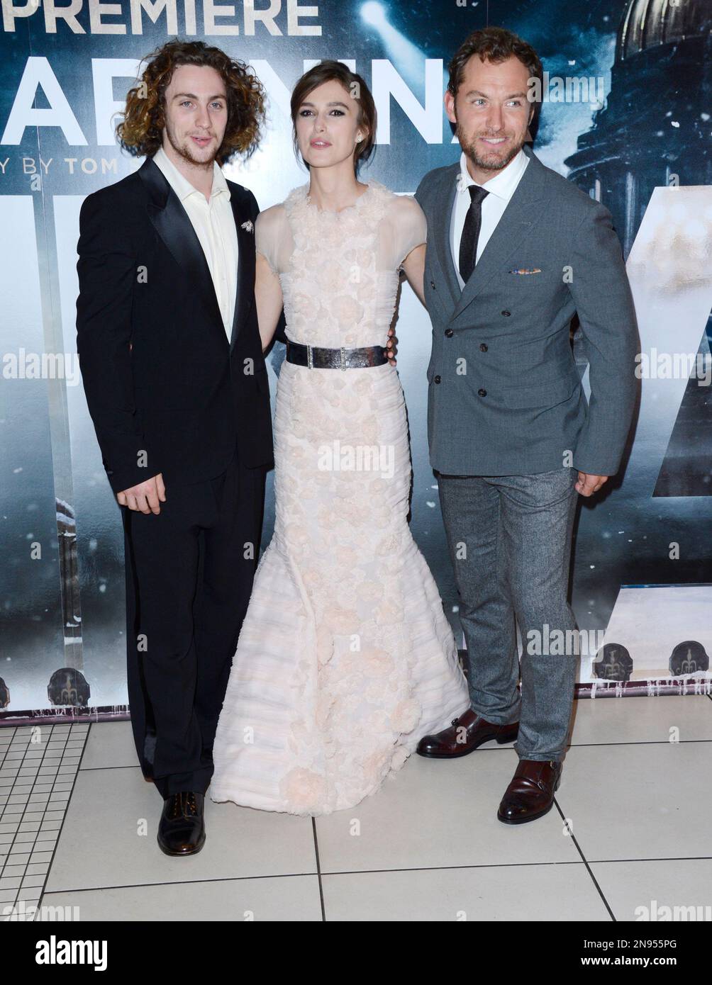 Aaron Taylor Johnson, Keira Knightley, Jude Law poses at Anna Karenina World Premiere at Odeon ...