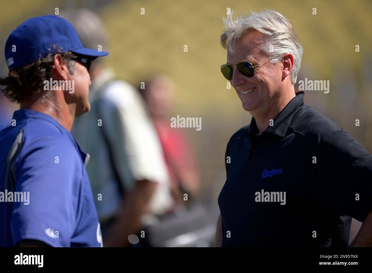 Los Angeles Dodgers co-owner Mark Walter, right, talks with manager Don ...