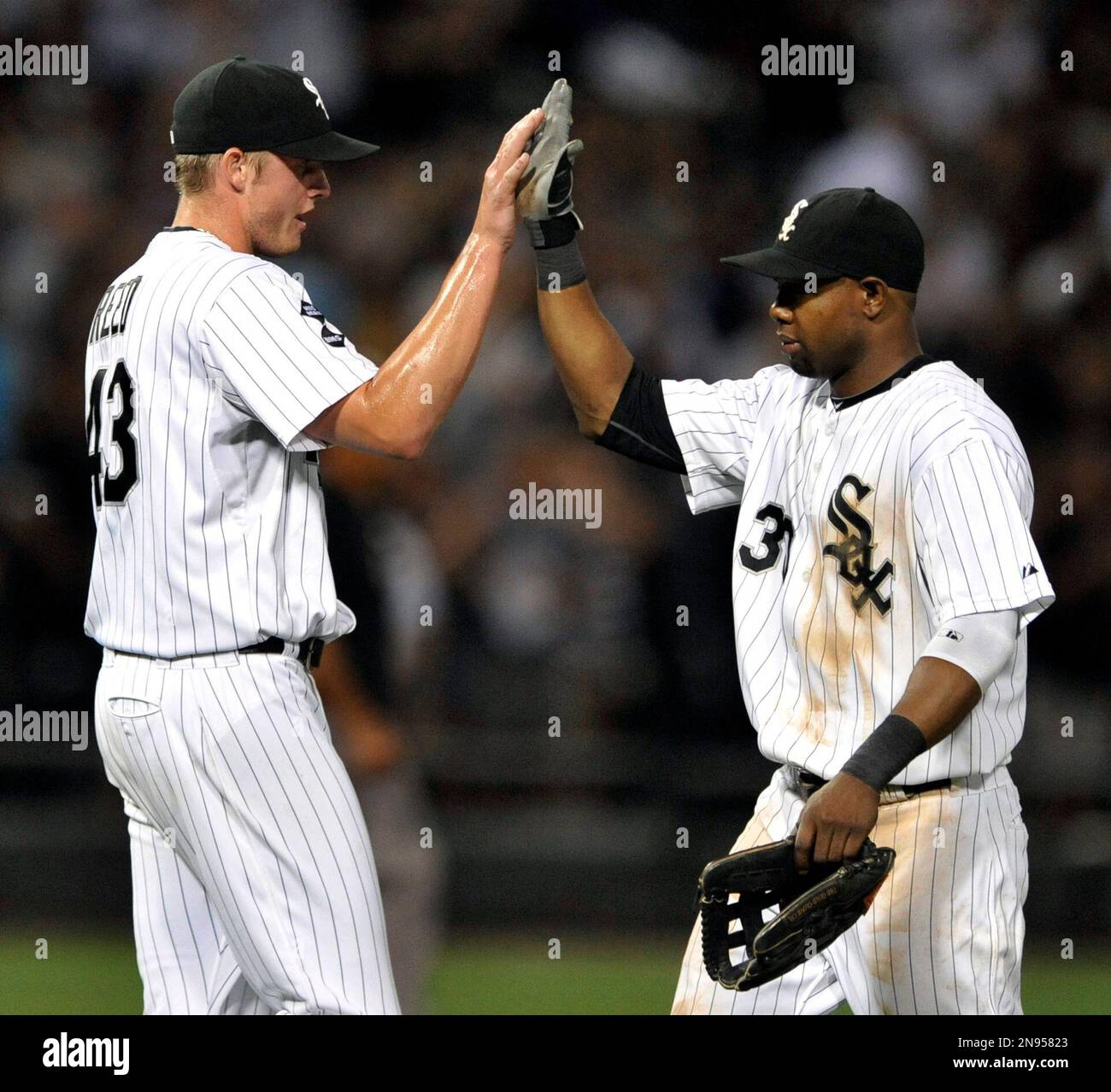 Chicago White Sox closing pitcher Addison Reed, left, celebrates with ...