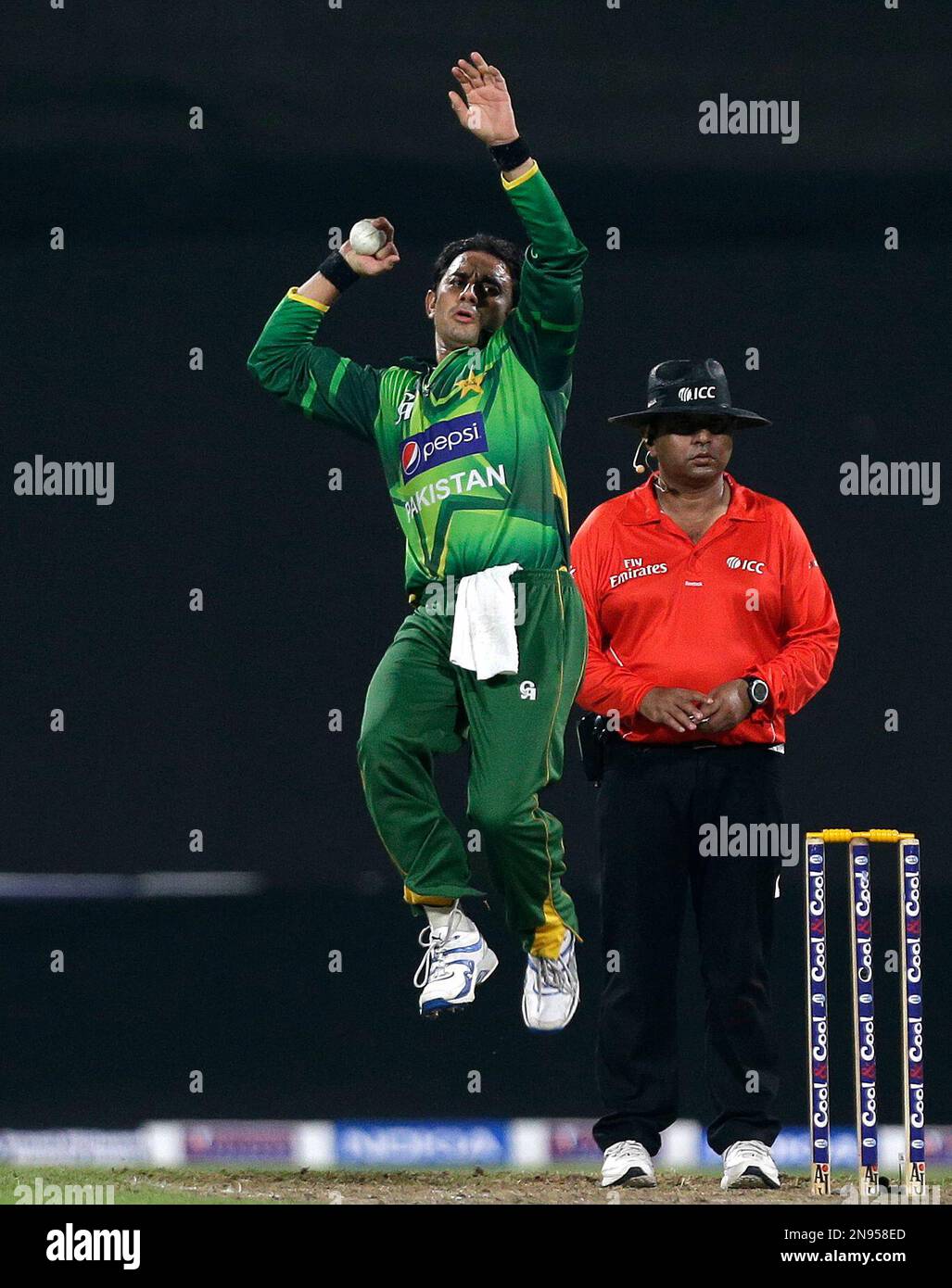 Pakistan's bowler Saeed Ajmal bowls a delivery during the third cricket ...
