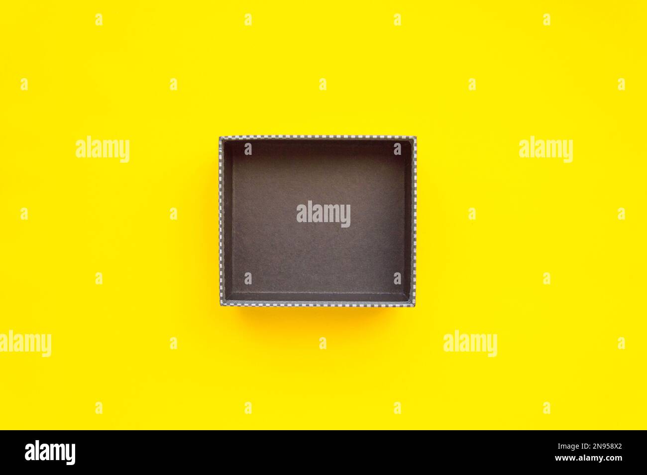 square box on a yellow background Stock Photo - Alamy