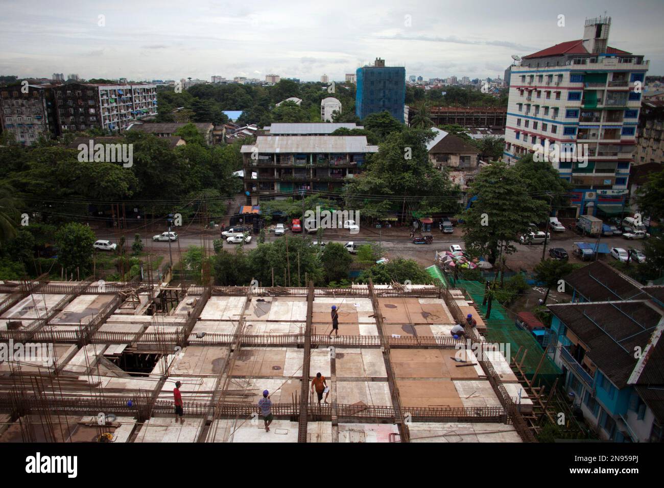 Construction workers labor on a project in Yangon, Myanmar, Monday ...