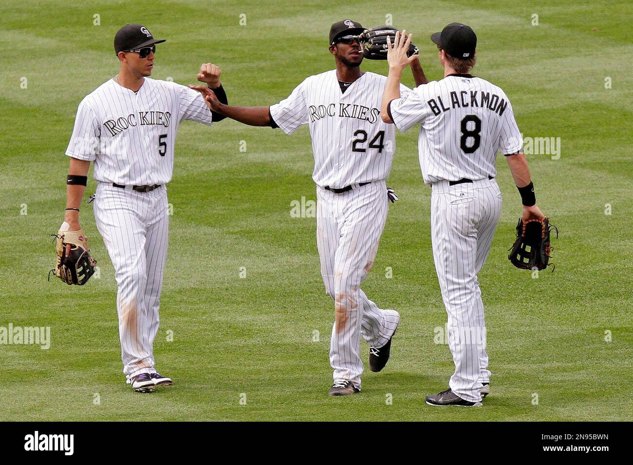 From left, Colorado Rockies outfielders Carlos Gonzalez, Dexter Fowler ...