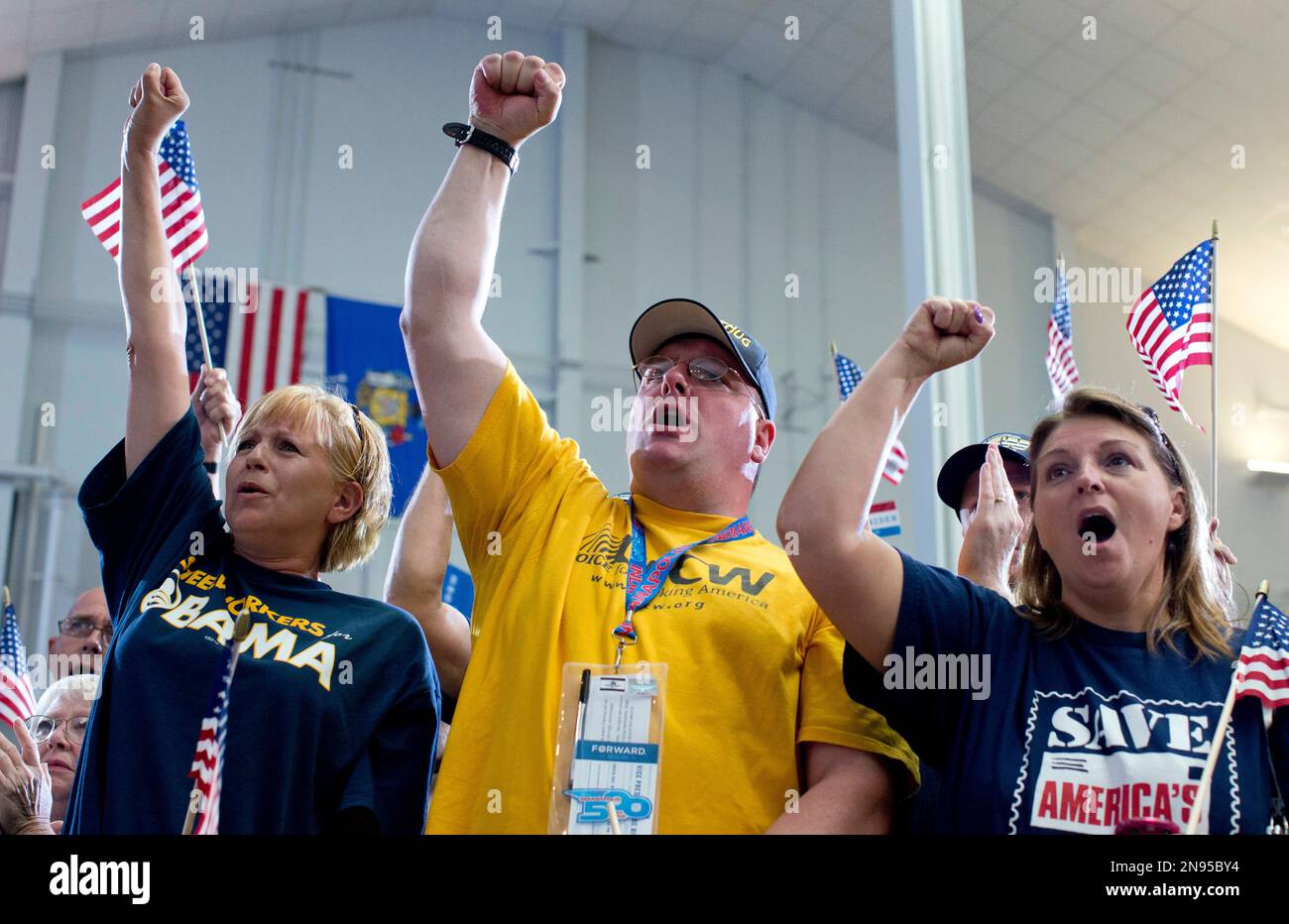People in the crowd cheer as Vice President Joe Biden speaks during a ...