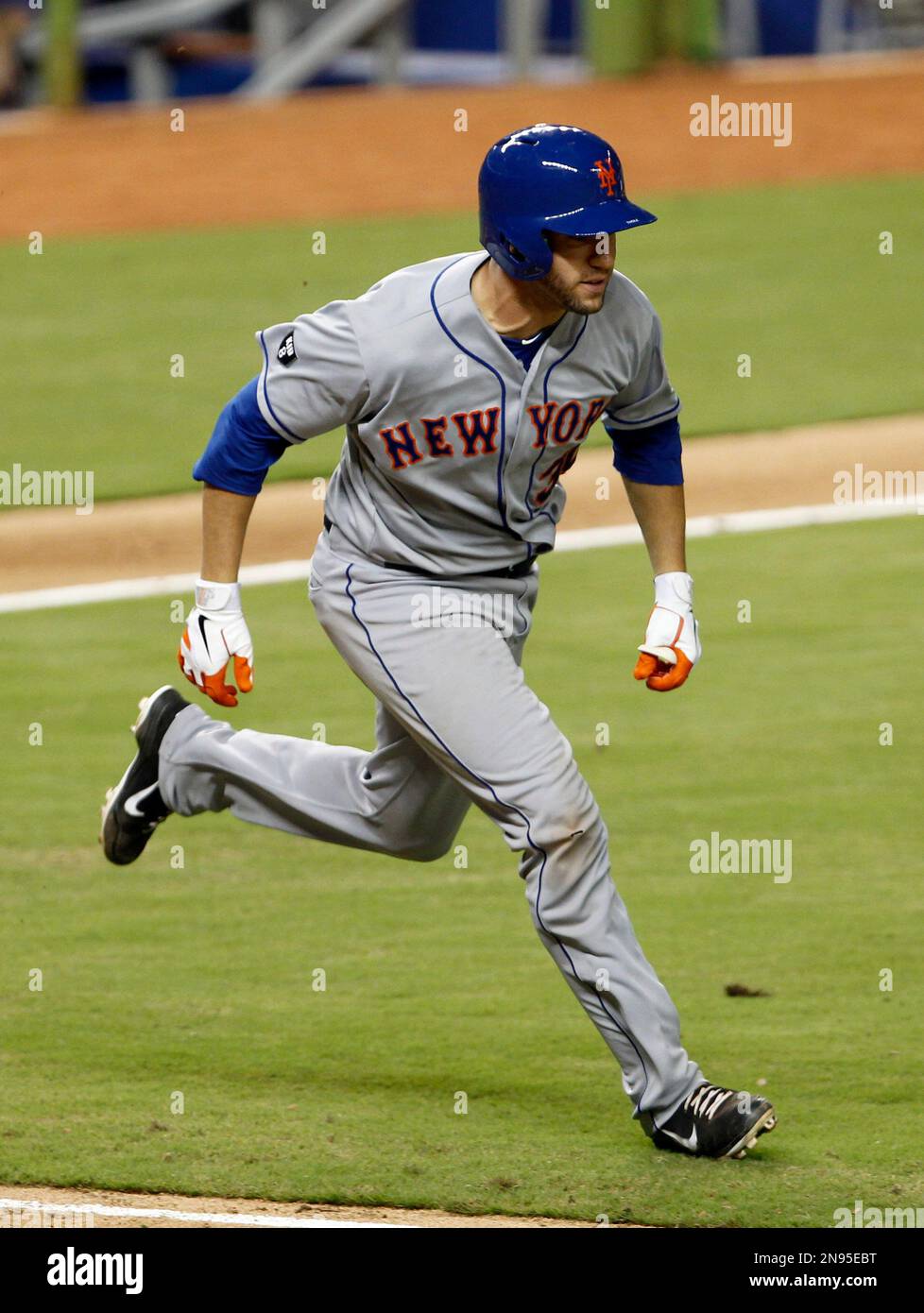 New York Mets' Josh Thole heads to first base during a baseball game ...