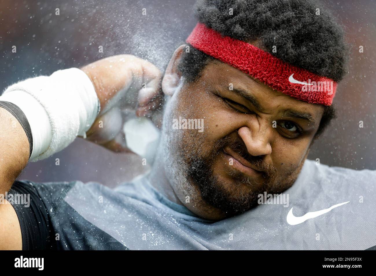 United States Reese Hoffa prepares his neck during the men's shot put ...