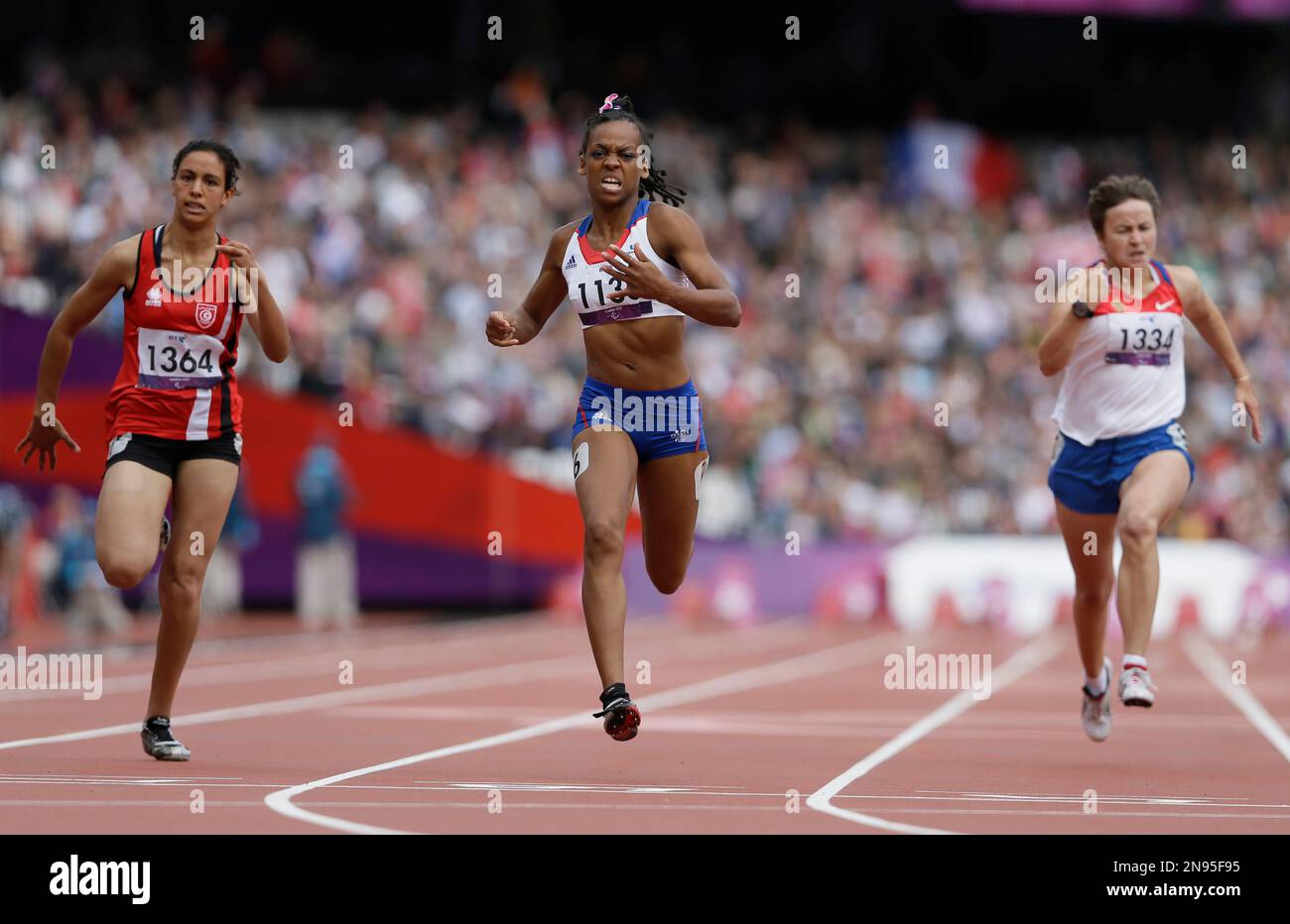 France's Mandy Francois-Elie, center, wins her women's 100m T37 heat ...