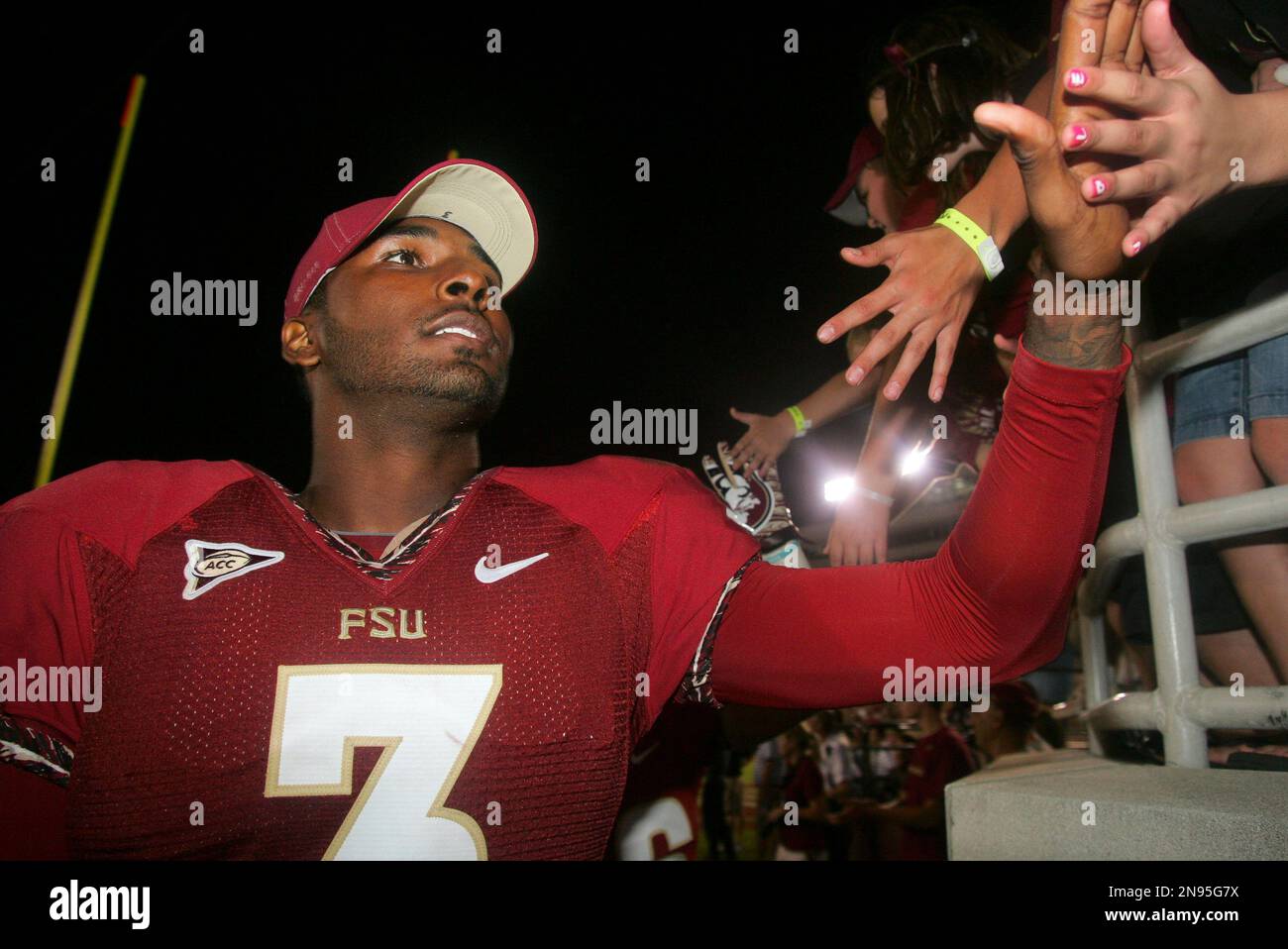 Florida State quarterback E.J. Manuel (3) celebrates with a fan after ...