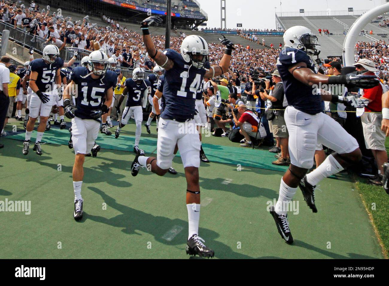 Penn State safety Jordan Lucas (14) runs onto the field for warm ups ...