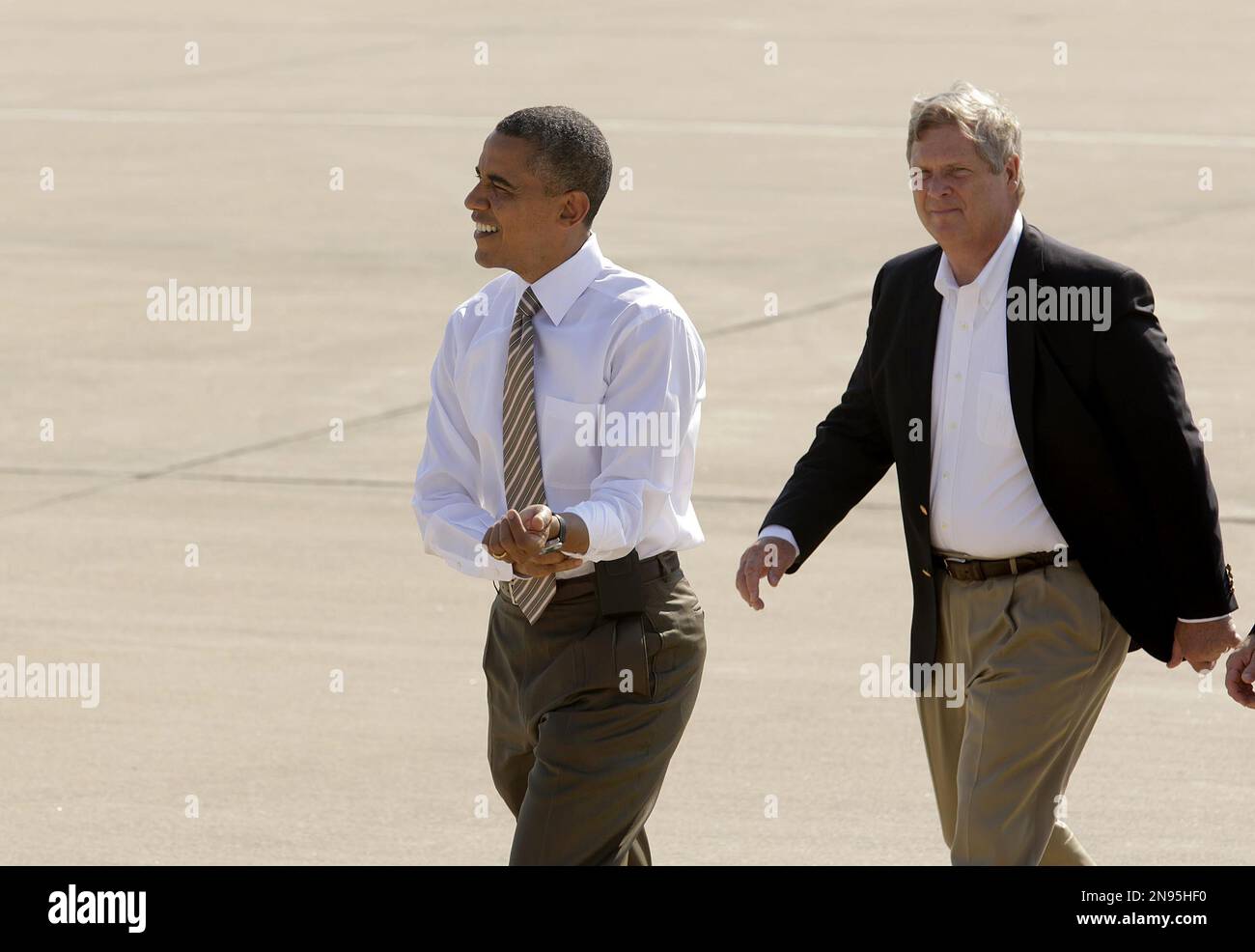 President Barack Obama, followed by Agriculture Secretary Tom Vilsack ...