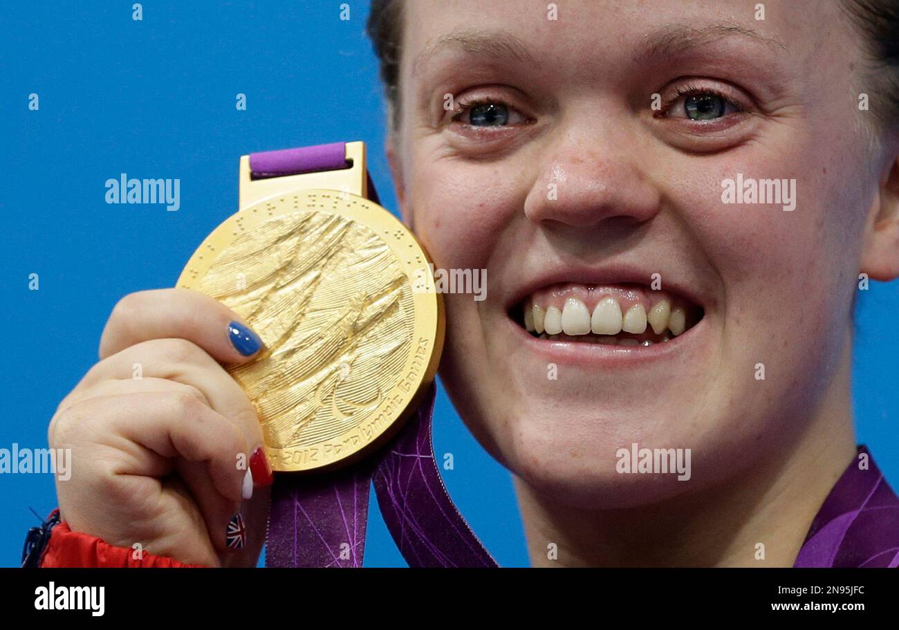 Ellie Simmonds of Britain celebrates with her gold medal for the women ...