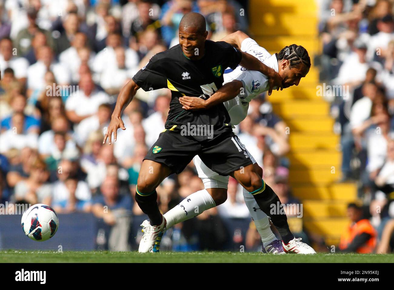 Tottenham Hotspur's Benoit Assou-Ekotto, right, competes with Norwich ...