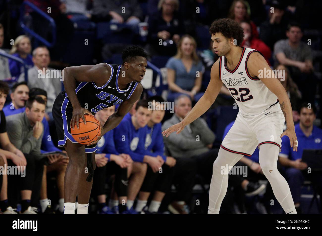 BYU forward Gideon George (5) controls the ball while defended by ...