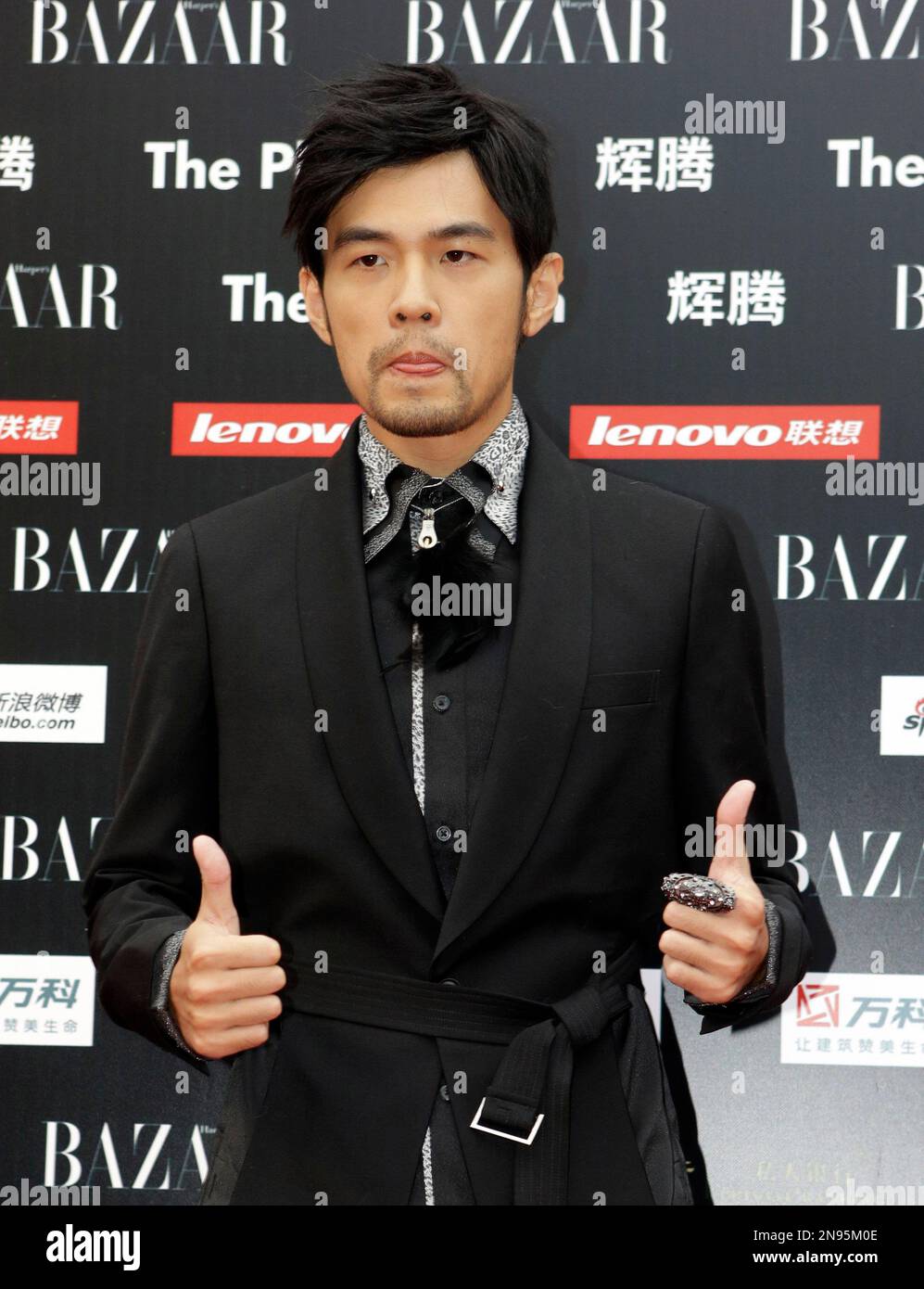 Taiwanese singer actor Jay Chou poses for photographers at a charity ...