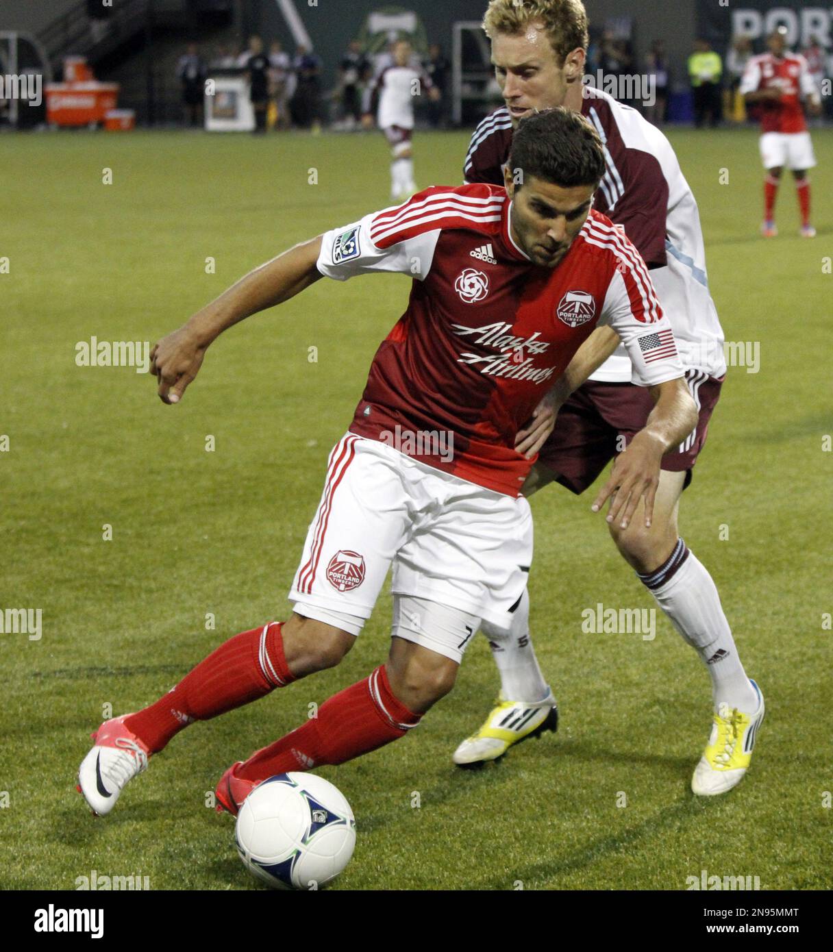 Portland Timbers midfielder Sal Zizzo, left, works the ball against ...
