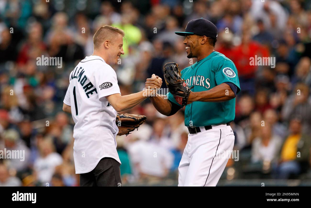 Hip hop artist Macklemore, also known as Ben Haggerty, shakes hands ...