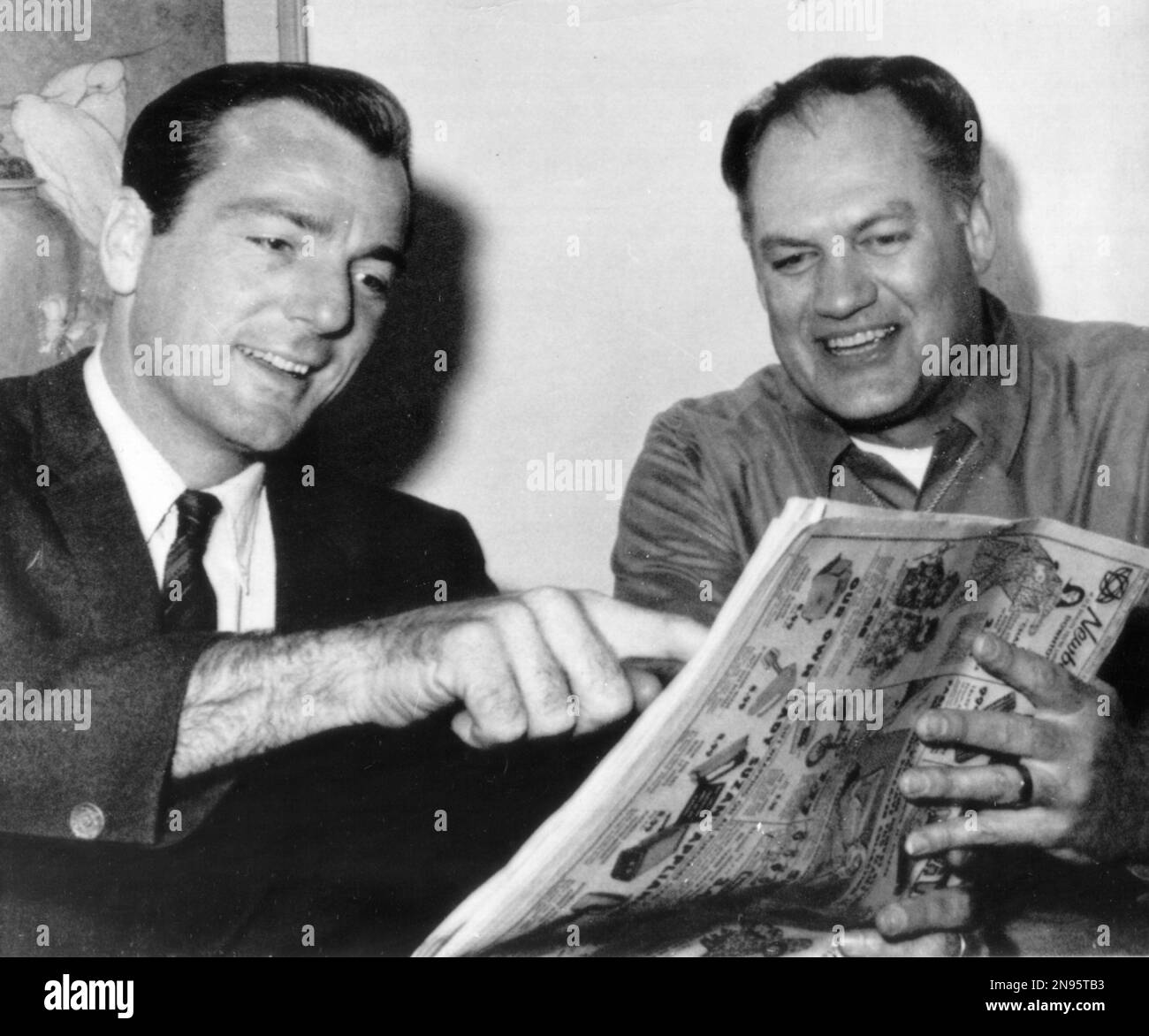 Bob Mathias, left, two-time Olympic decathlon winner, happily points to ...
