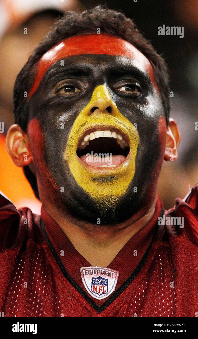 An Arizona Cardinals fan cheers on his team during the second half of a ...