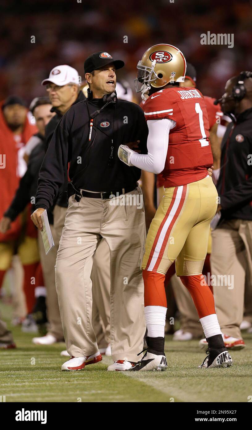 San Francisco 49ers head coach Jim Harbaugh talks with quarterback Josh ...