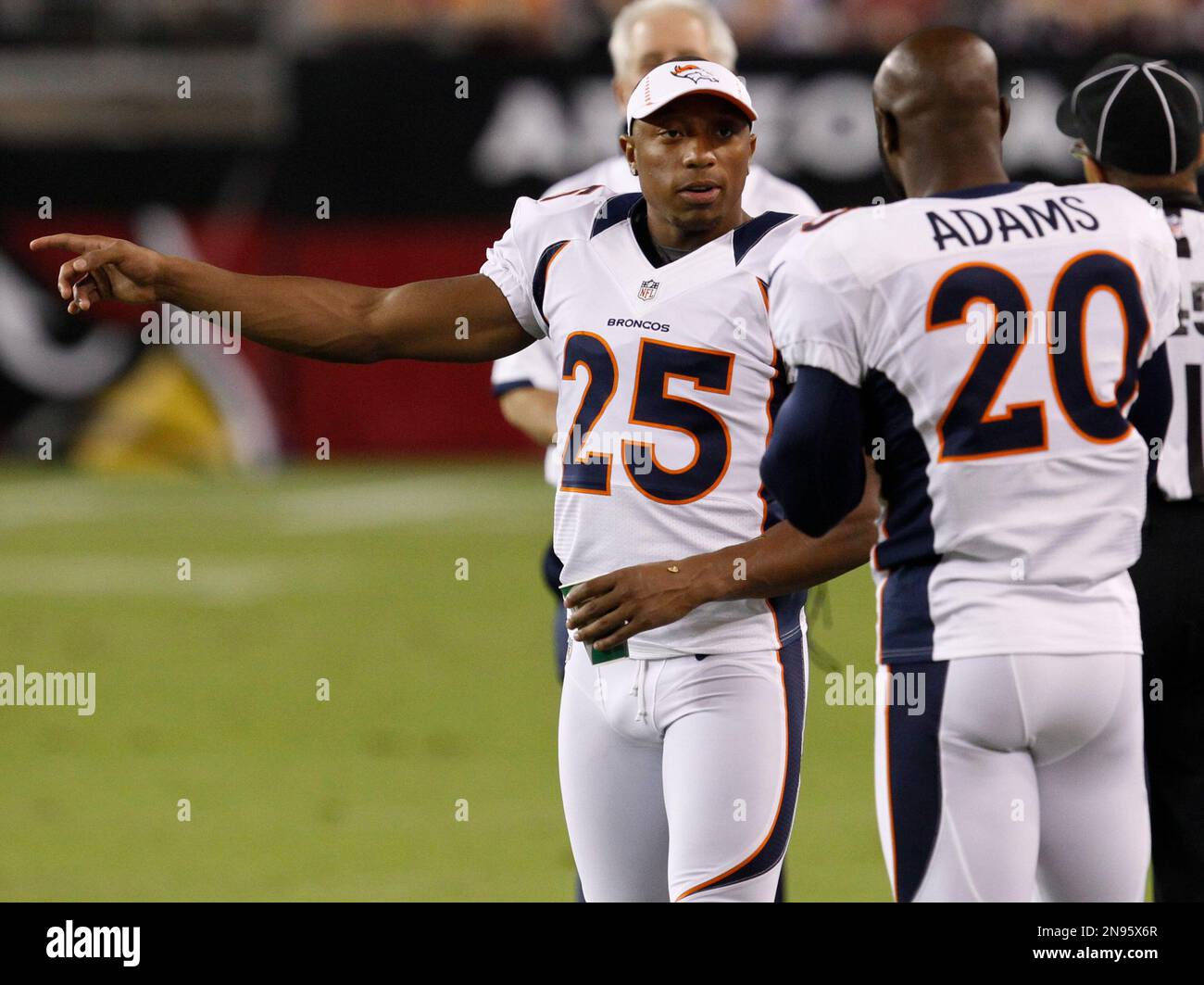 Denver Broncos strong safety Chris Harris (25) and Mike Adams (20) talk ...