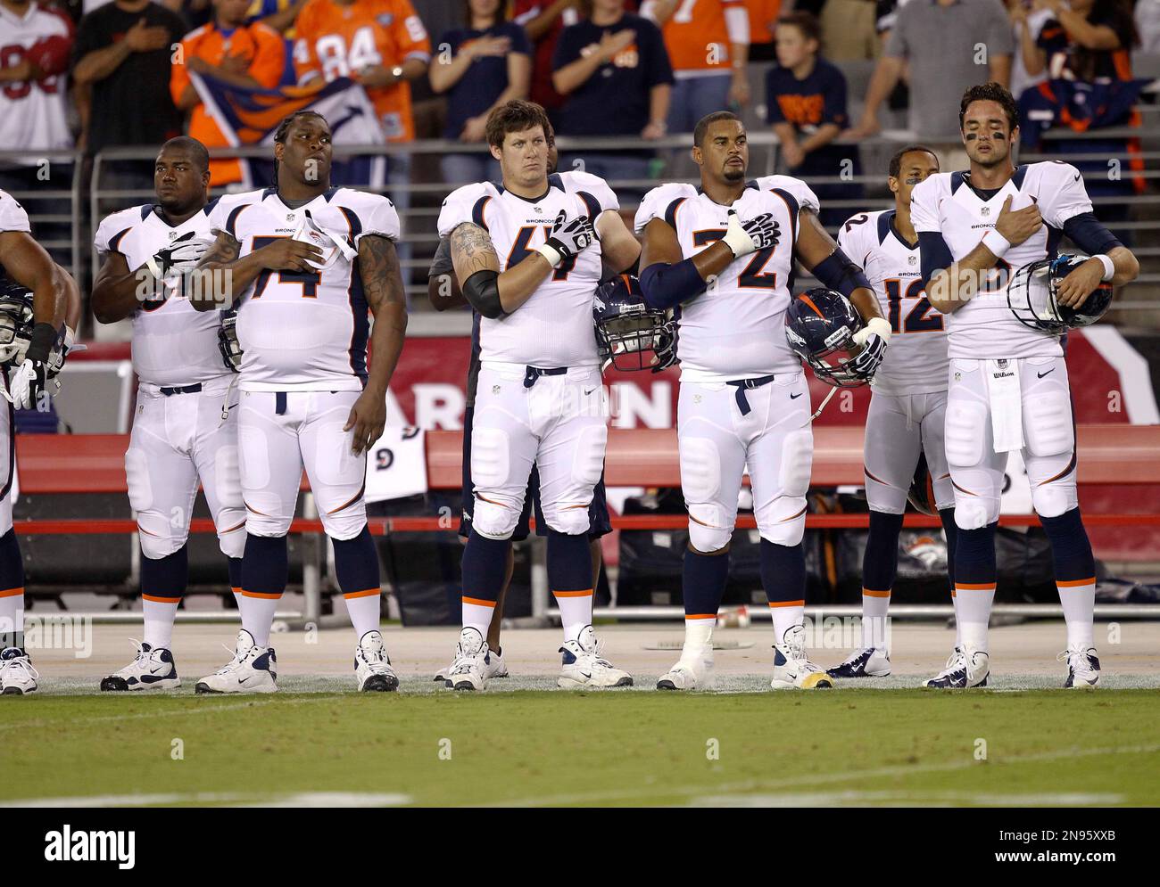 The Denver Broncos line up for the national anthem prior to an NFL ...