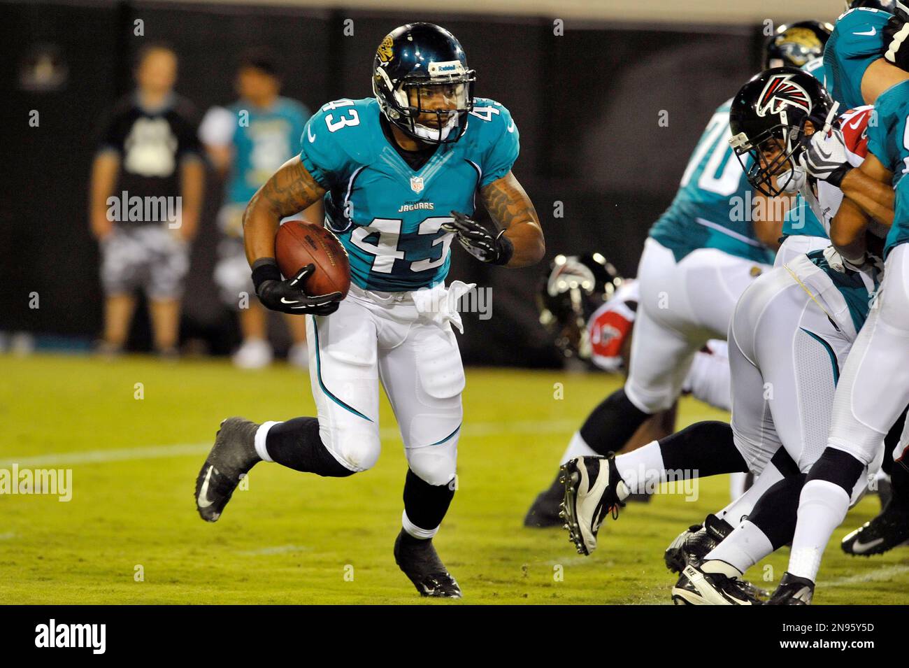 Jacksonville Jaguars running back Keith Toston (43) looks for running ...