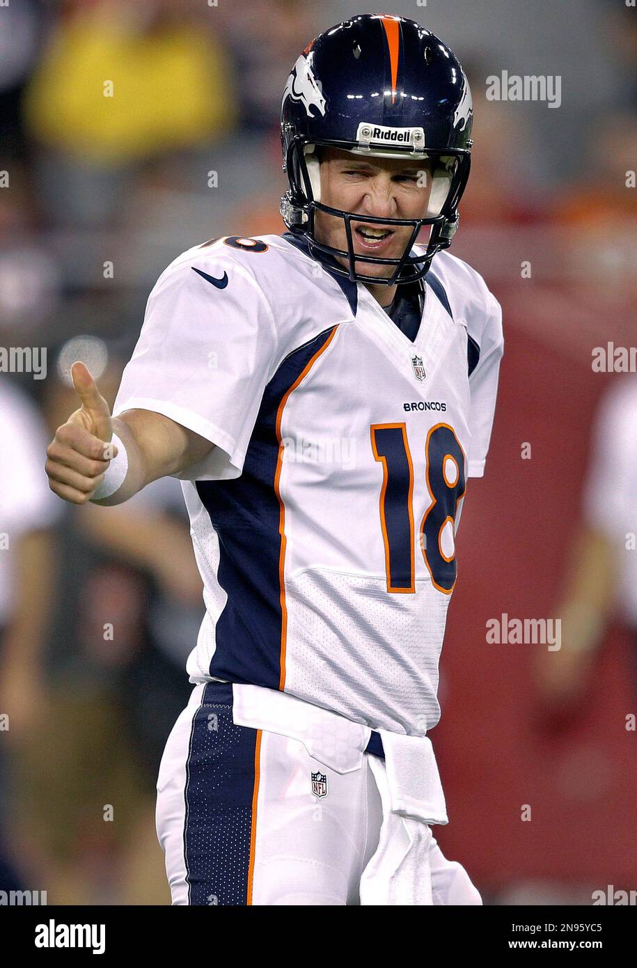 Denver Broncos quarterback Peyton Manning (18) gives the thumbs up ...