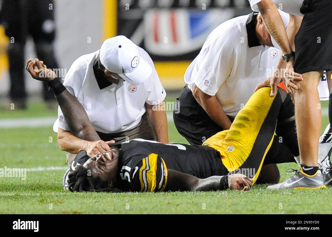 Pittsburgh Steelers linebacker Sean Spence (51) is tended to by ...