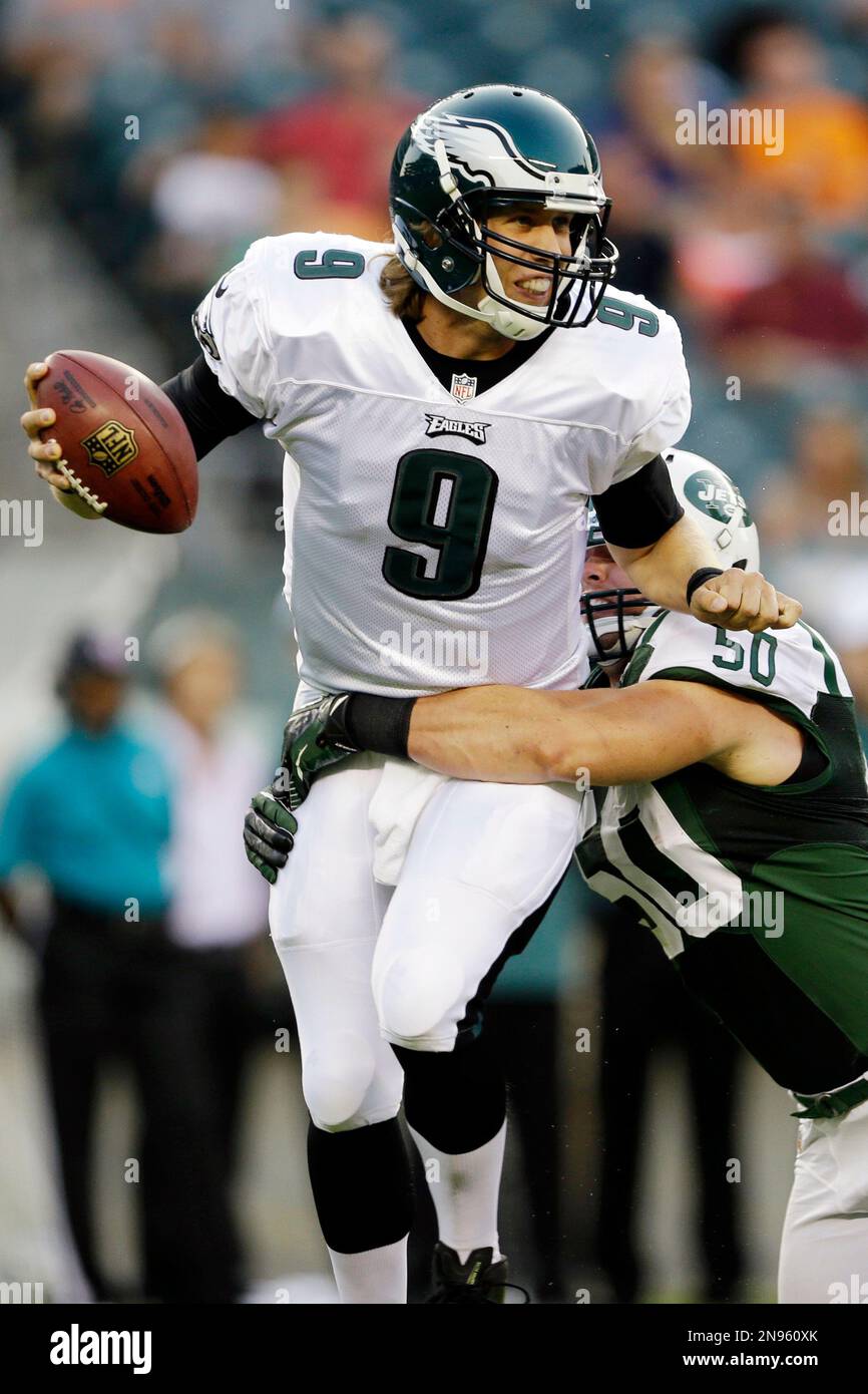 Philadelphia Eagles quarterback Nick Foles (9) is tackled by New York ...