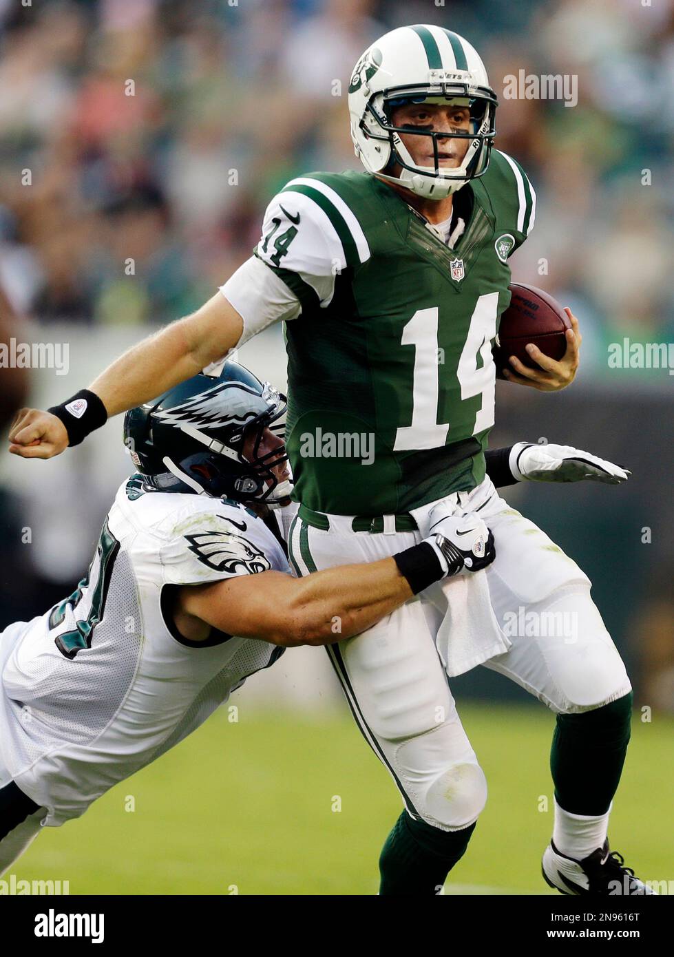 New York Jets quarterback Greg McElroy (14) is tackled by Philadelphia ...