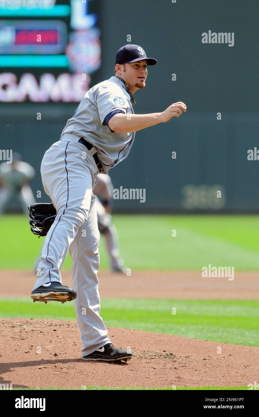 Seattle Mariners pitcher Blake Beavan throws against the Minnesota ...